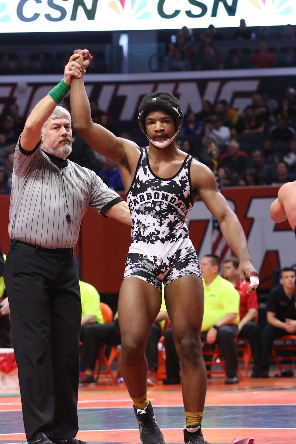 Carbondale’s Cameron Caffey climbs to the top of the Class 2A 182-pound ...